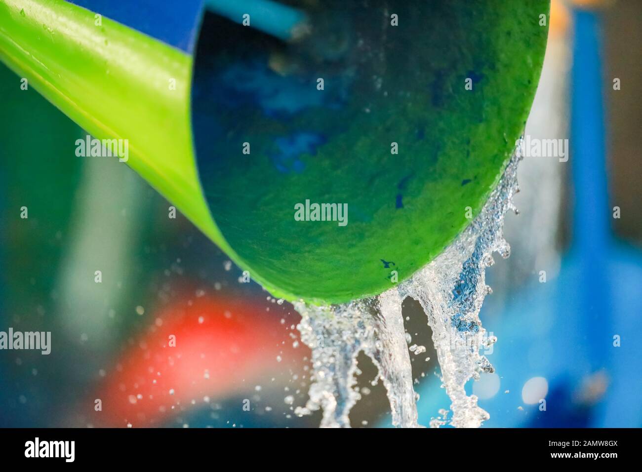 Close up of water flowing out from water tank Stock Photo - Alamy