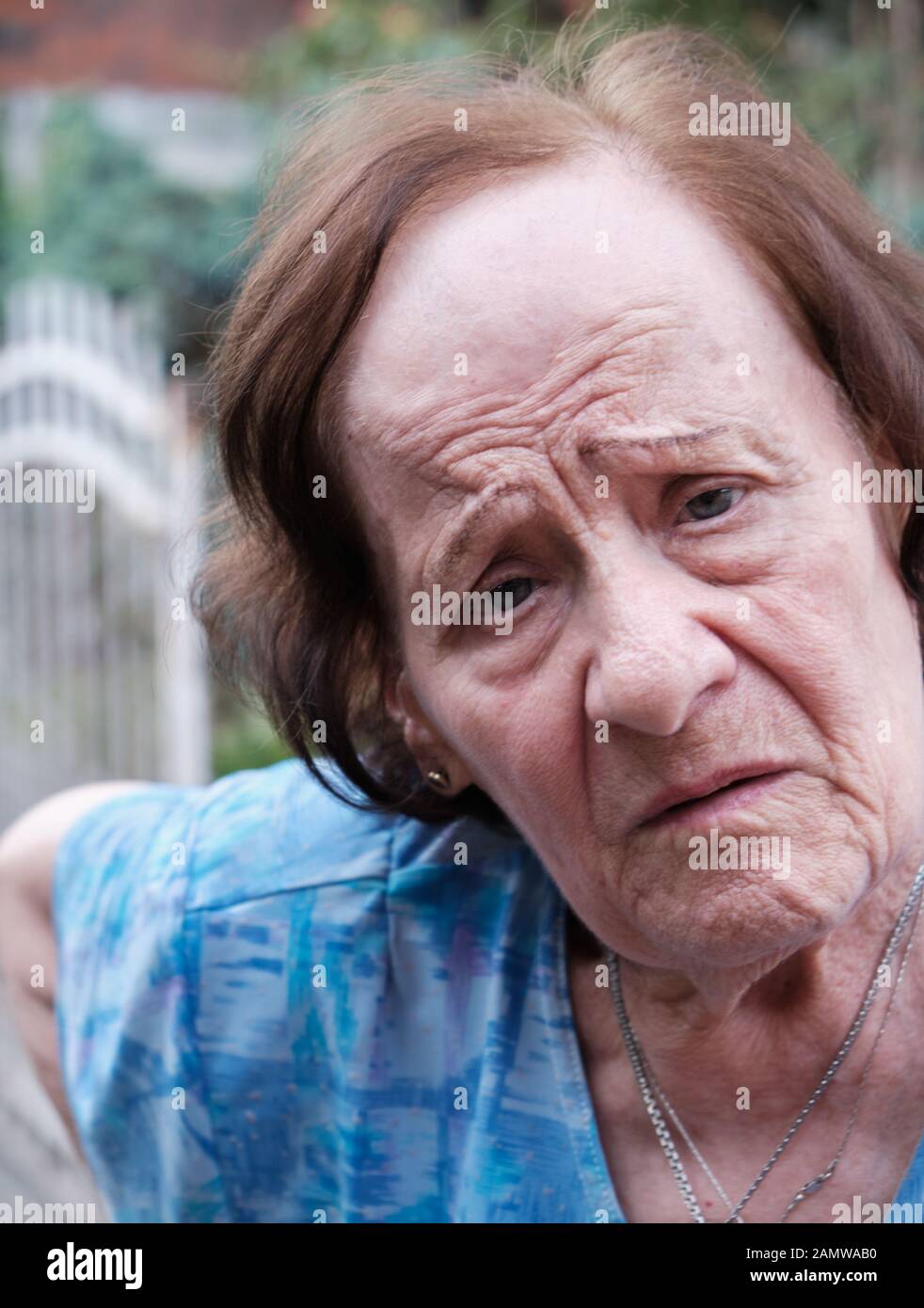 a portrait of an old woman making an expression of concern Stock Photo ...