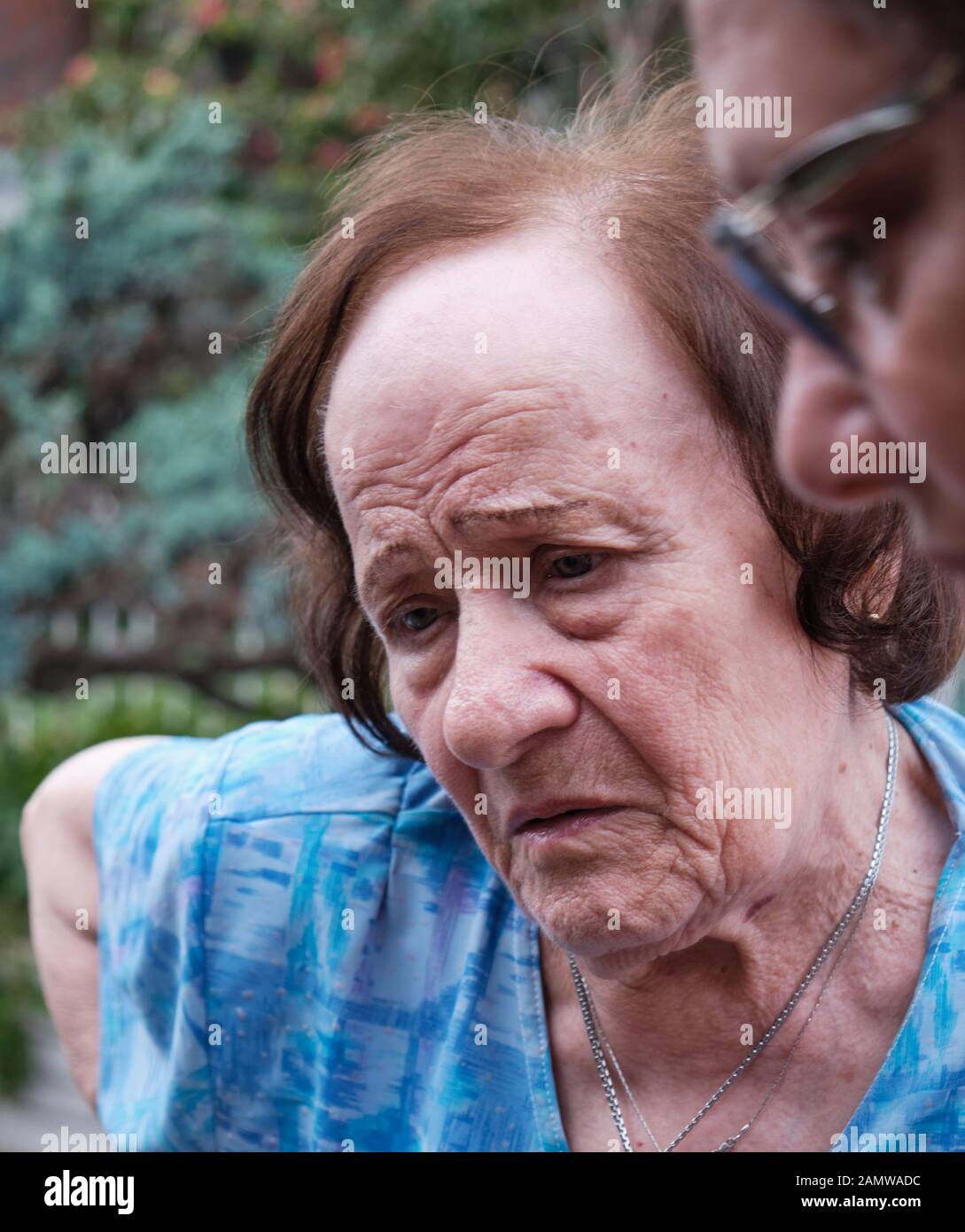 a portrait of an old woman making an expression of concern Stock Photo ...