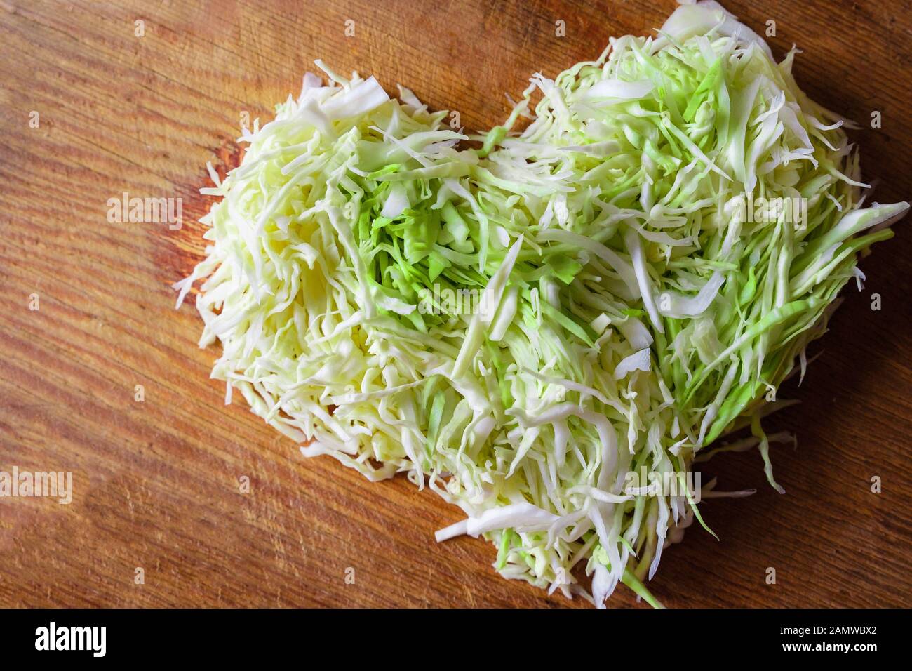 White cabbage and carrots finely chopped in the shape of a heart ...