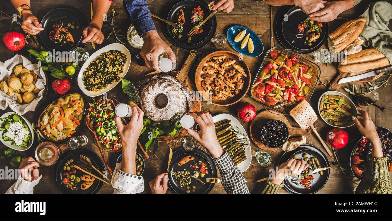 Traditional Turkish celebration dinner with food and raki, wide ...