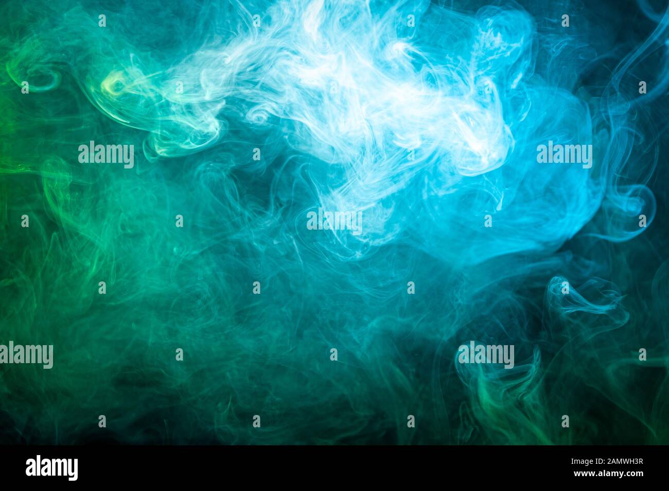 Pattern, Neon blue and green smoke in the on a dark isolated background ...
