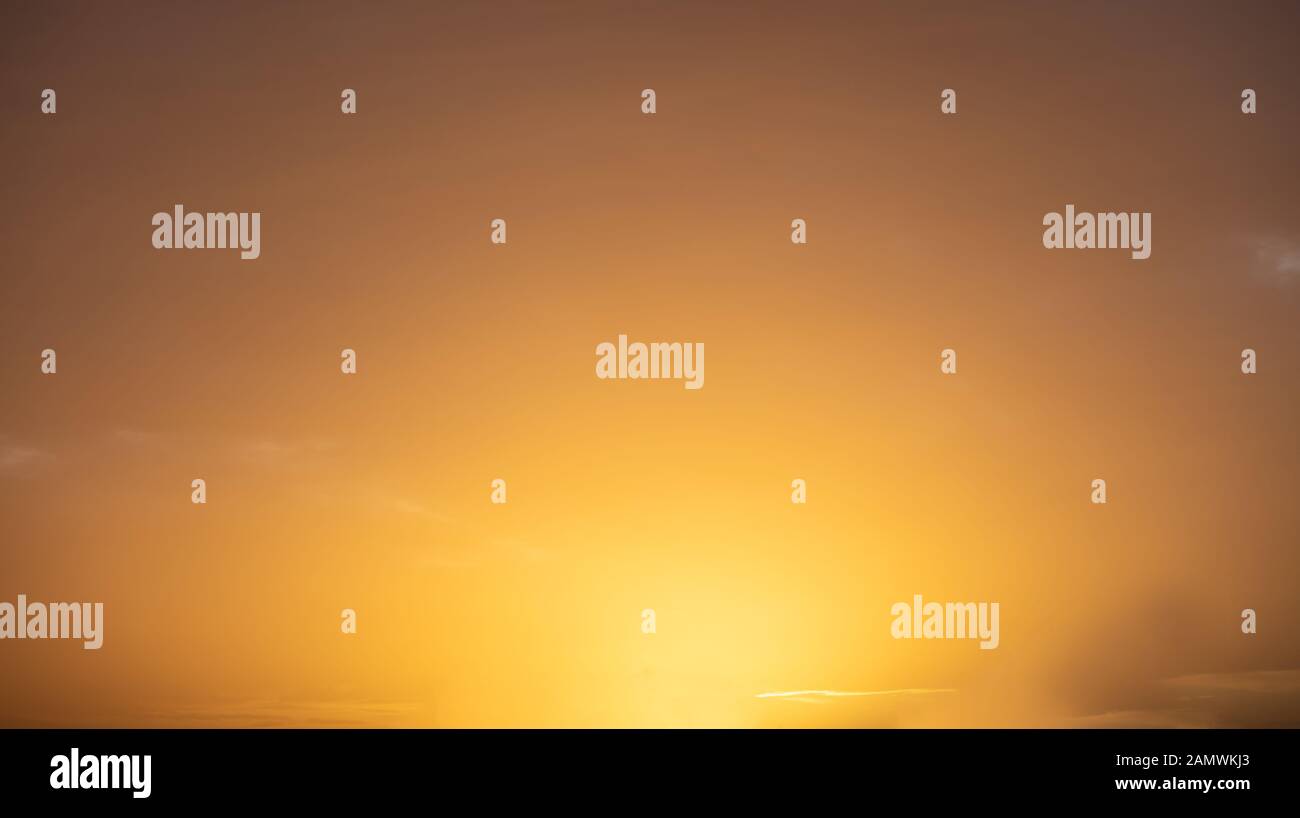 Sunset sky orange color. Clear sky yellow orange color at sunrise ...