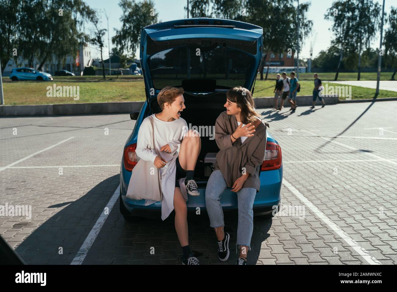 Two girls posing in car hi-res stock photography and images - Alamy