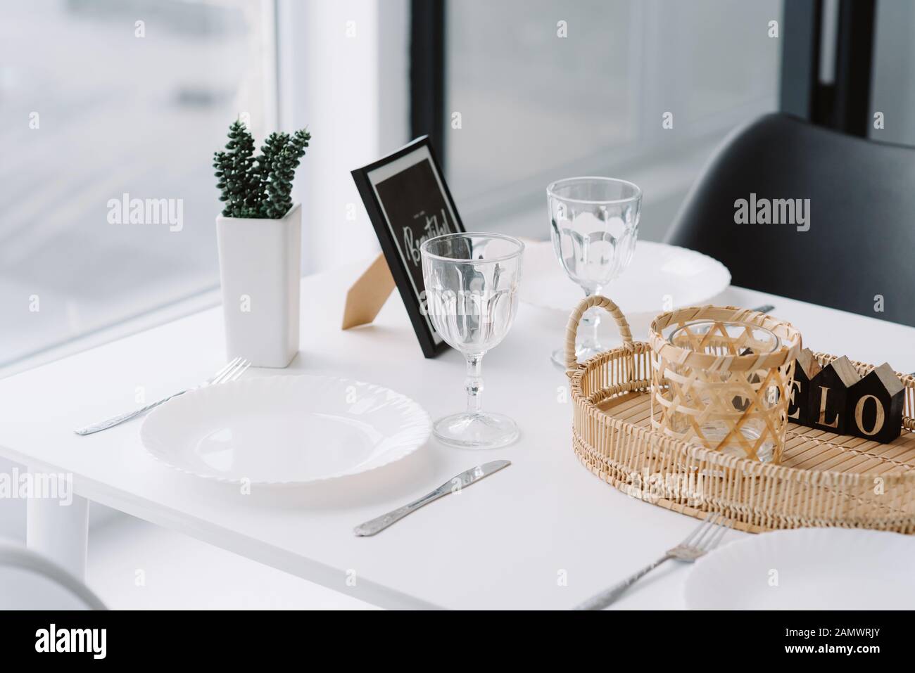 White dining table near the window. A stylish breakfast place. Modern ...