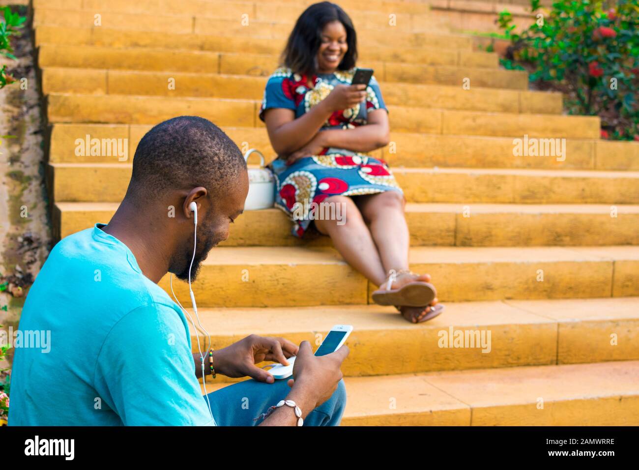 young black man sharing a wifi router with a friend outdoor Stock Photo ...