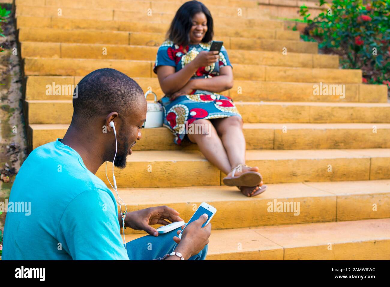 young african man sharing a wi-fi router with a friend outdoor Stock ...