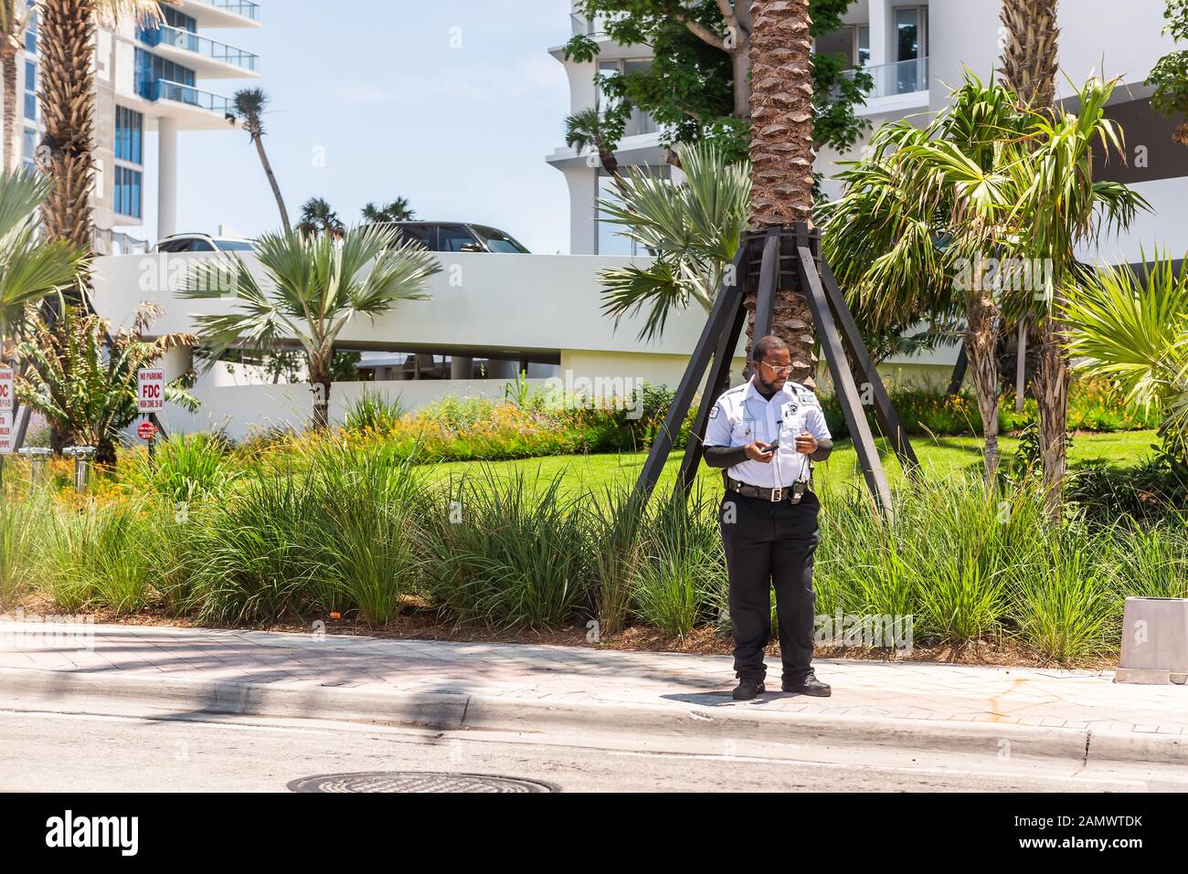 Sunny Isles Beach, USA - May 8, 2018: Security guard police officer man ...