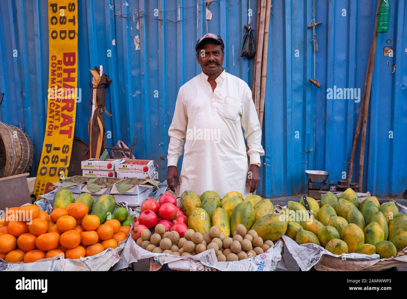A fruit vendor in Bhendi Bazar area, Mumbai, India, standing at his ...