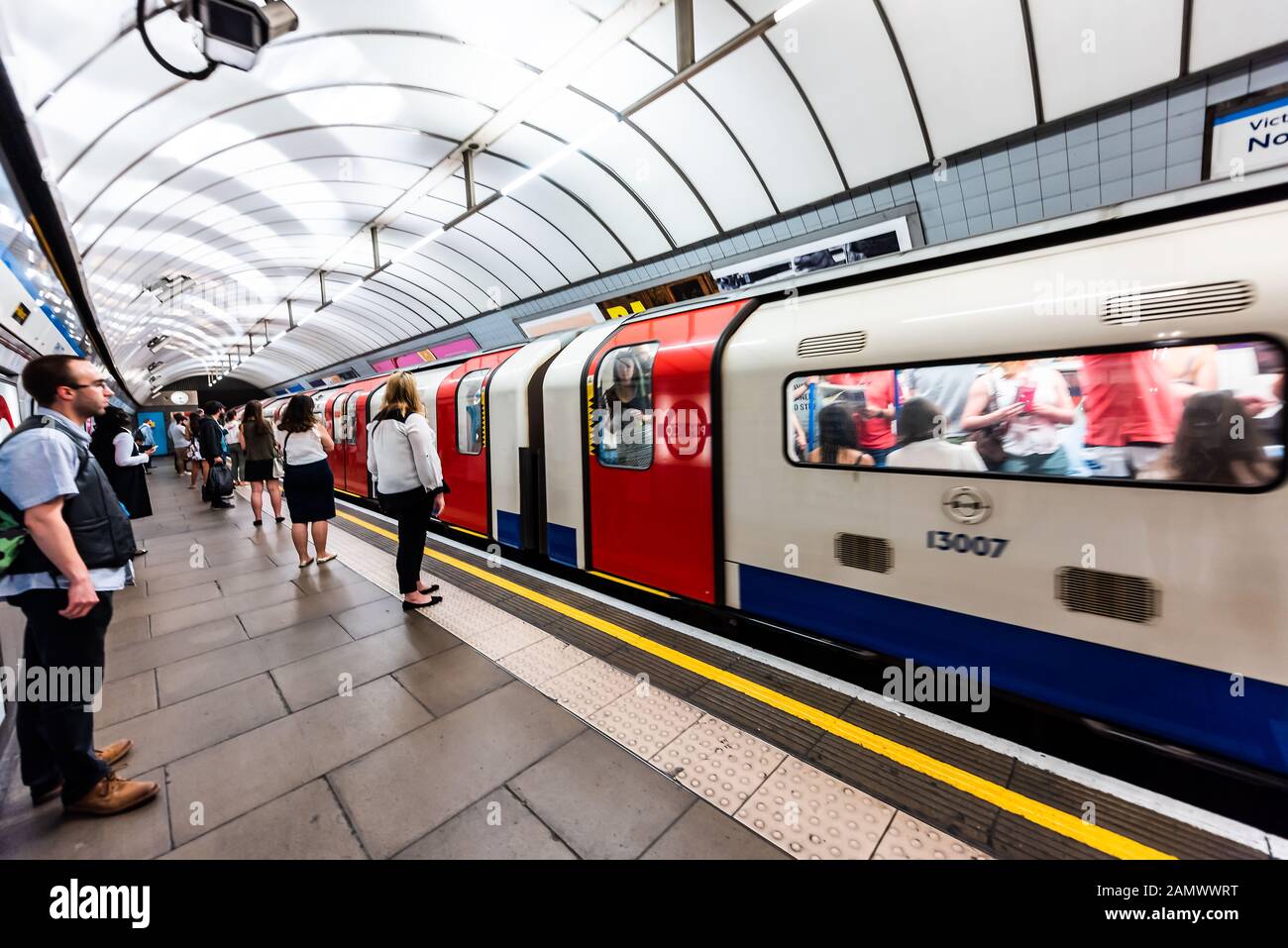 London, UK - June 26, 2018: Underground tube metro with moving blue red ...