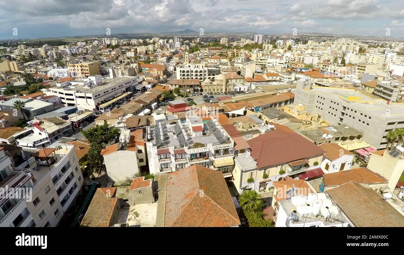 Architecture in Larnaca resort city center and cloudy skyline, travel ...