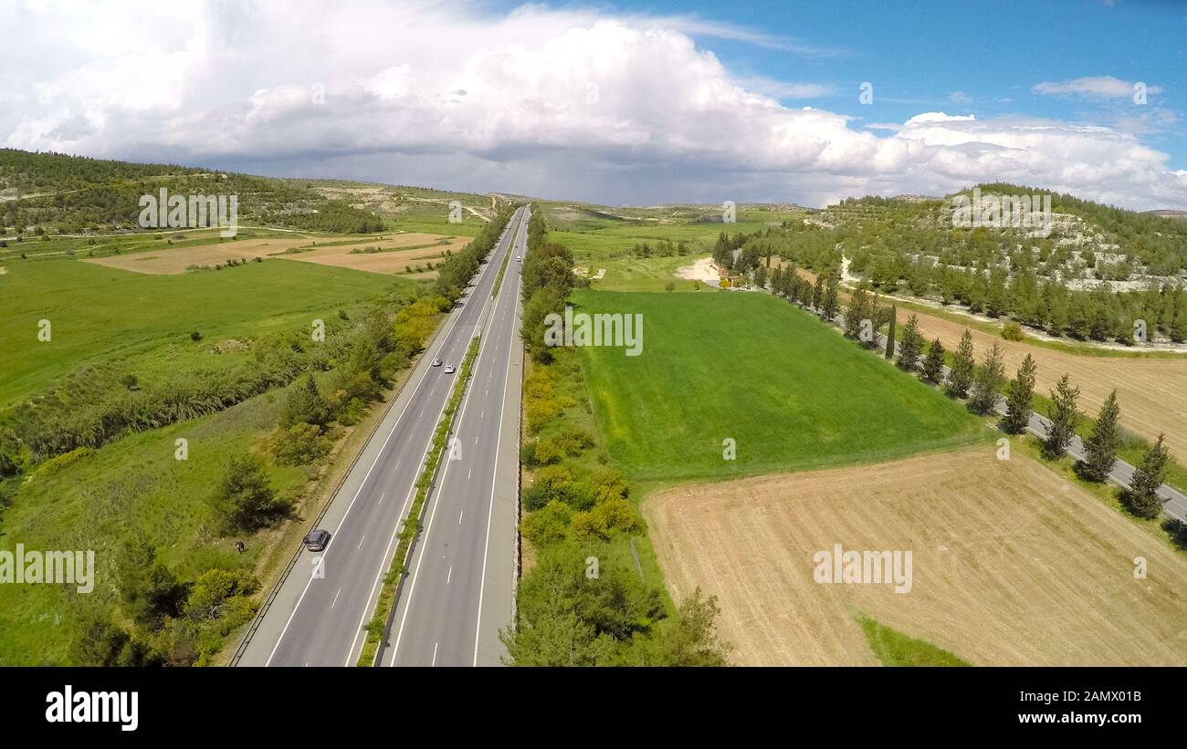Light traffic on toll highway, road in green hilly areas of Cyprus ...