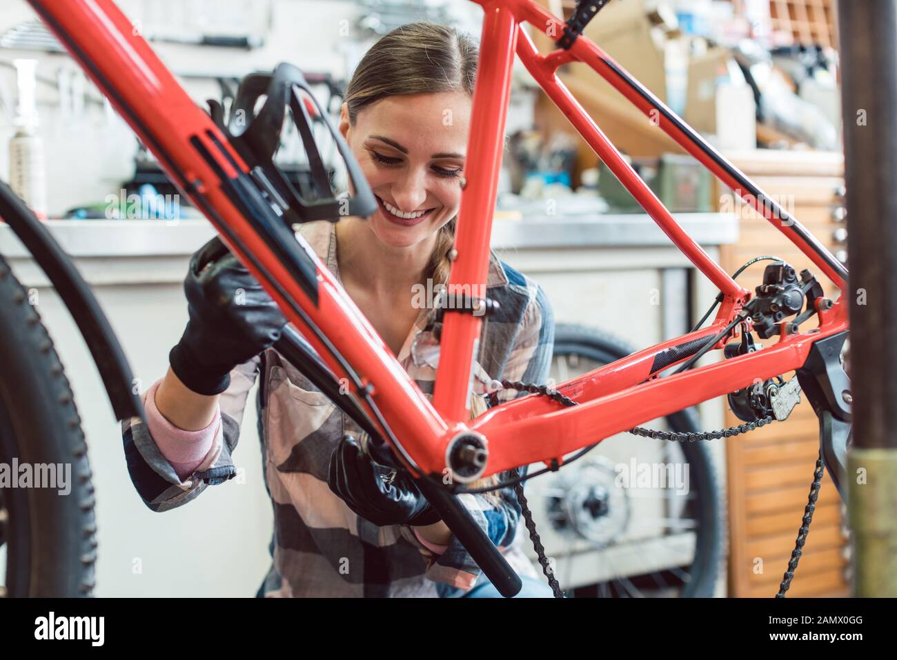 Bike mechanic working on gears of a bicycle Stock Photo - Alamy