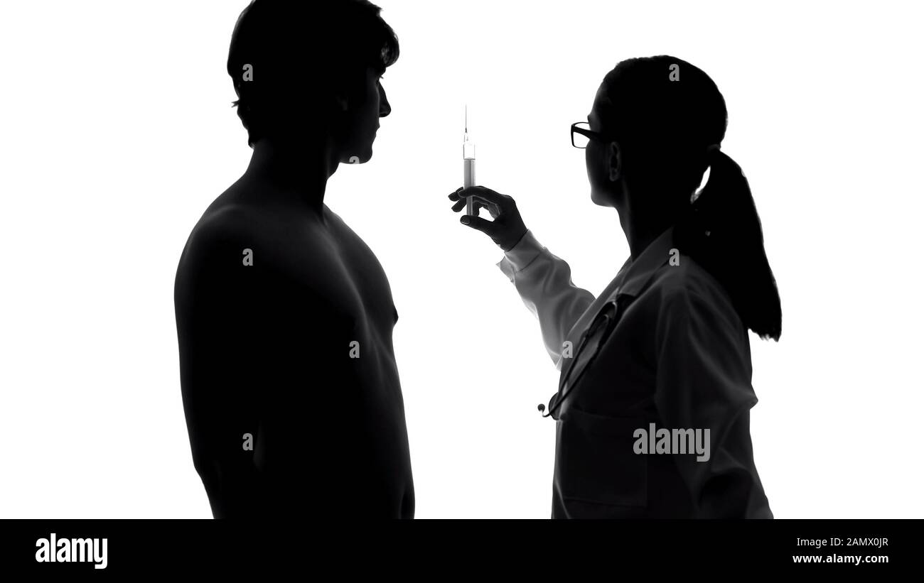 Nurse giving male patient injection Cut Out Stock Images & Pictures - Alamy