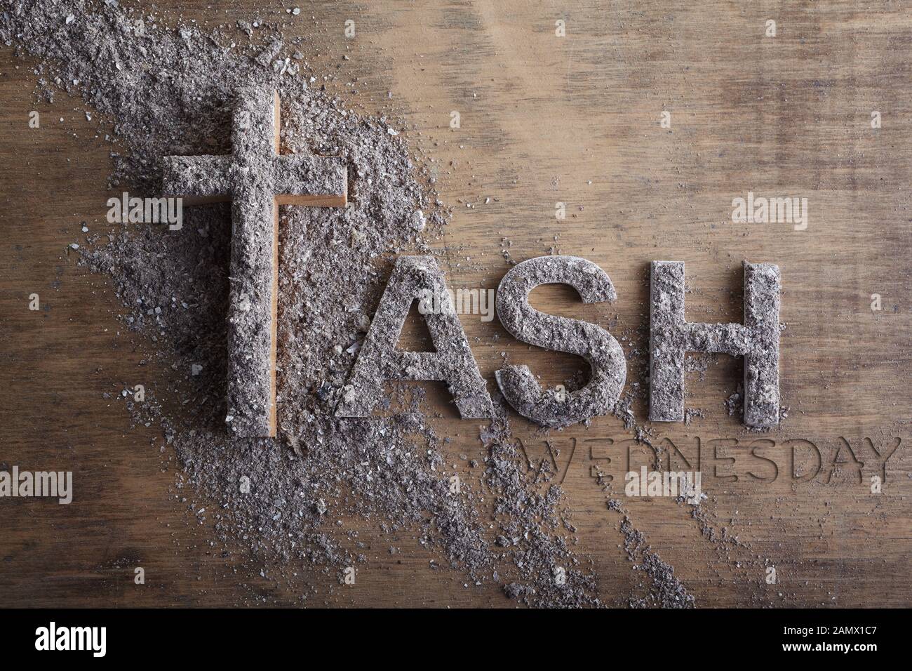 Ash wednesday word written in ash and christian cross symbol as a ...