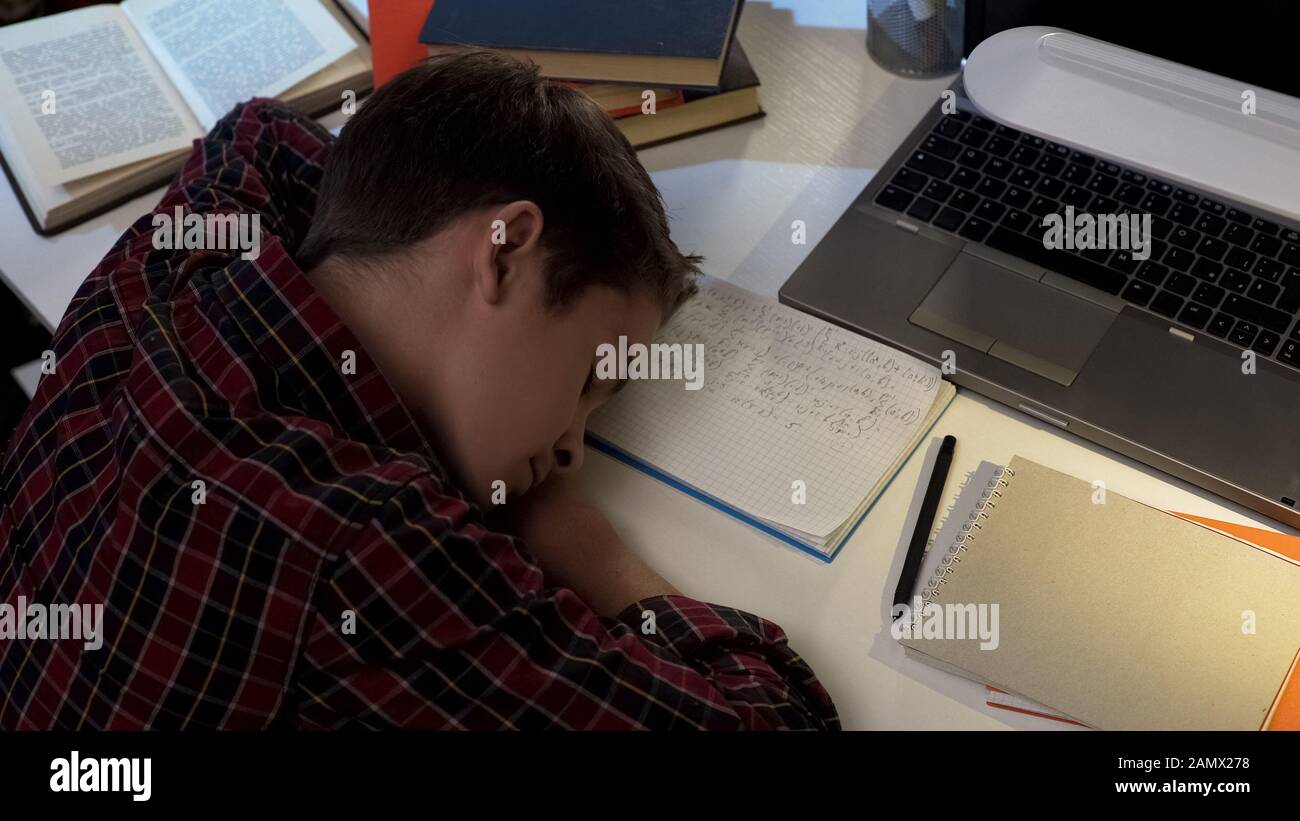 Young teenage student doing homework hi-res stock photography and ...