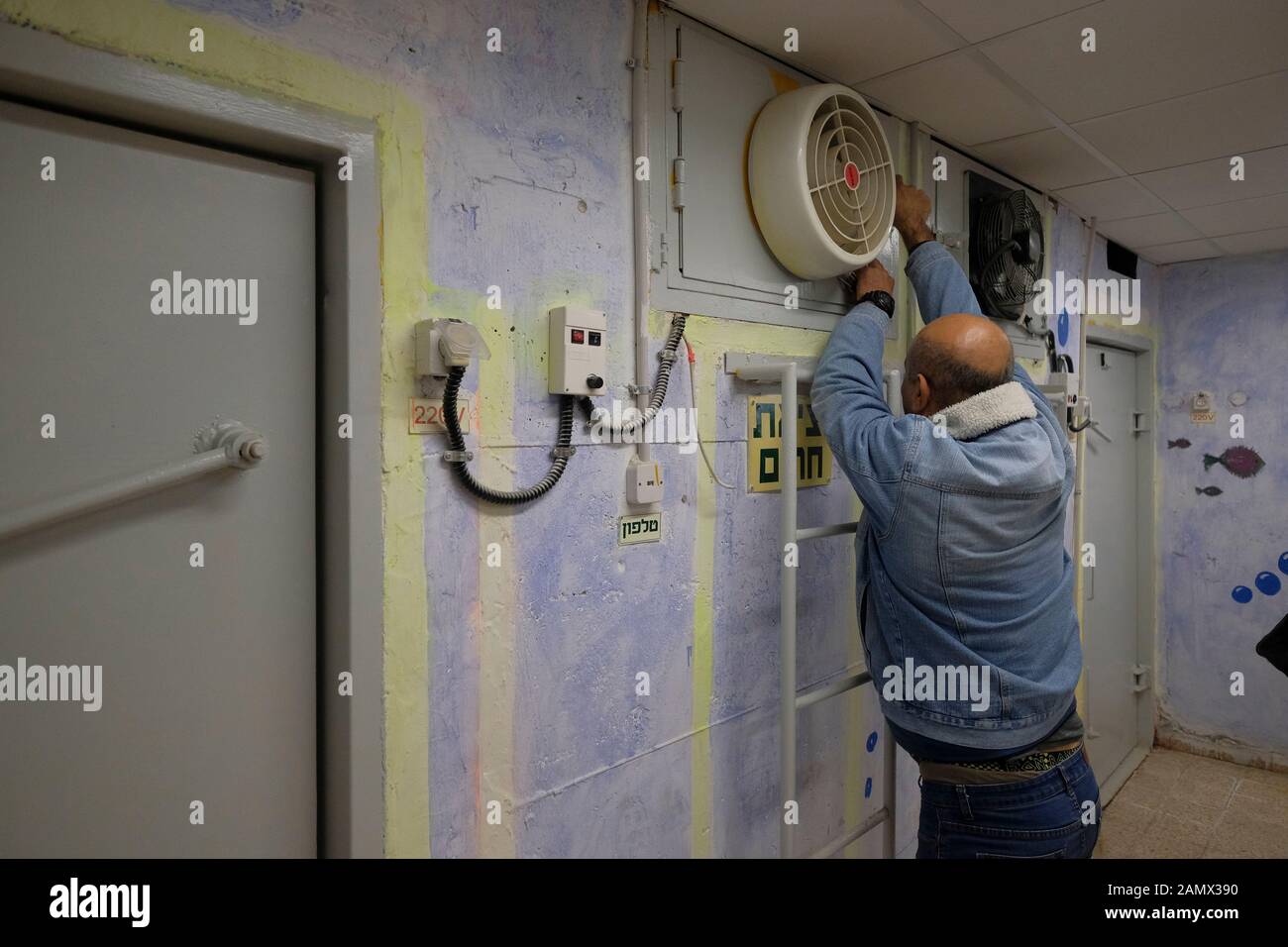 An Israeli civilian checks the ventilation a public bomb shelter in the ...