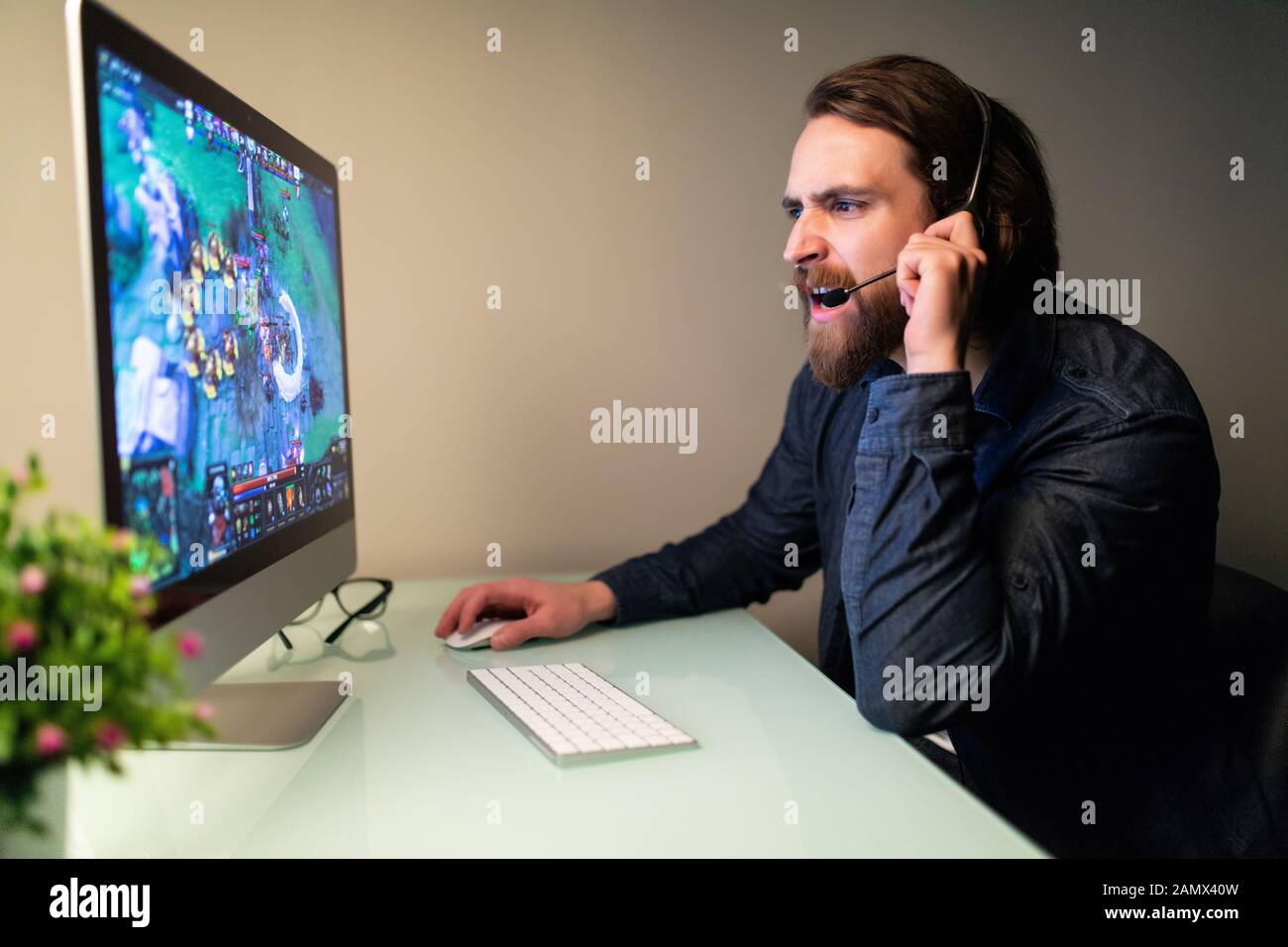 technology, gaming, let's play and people concept - young man or hacker ...