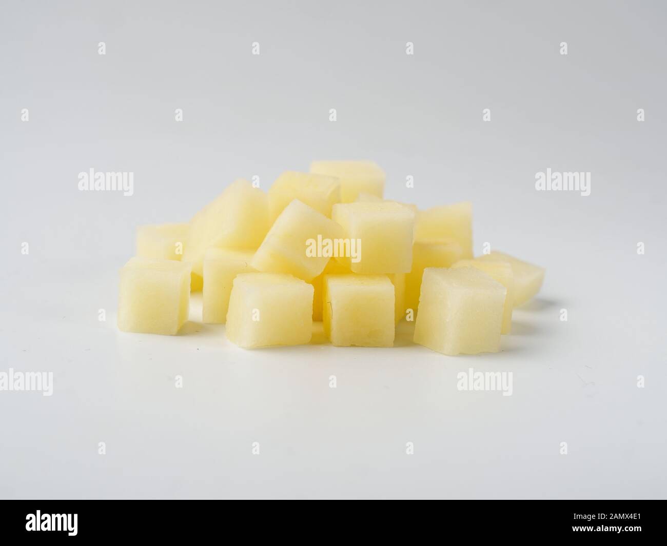 Heap of diced raw potatoes isolated on white background. Pile uncooked ...