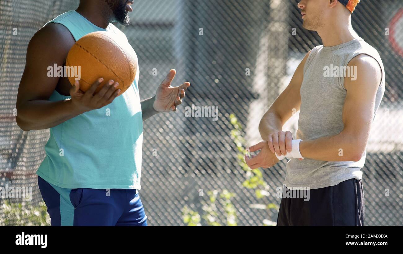 Male basketball players team talking hi-res stock photography and ...