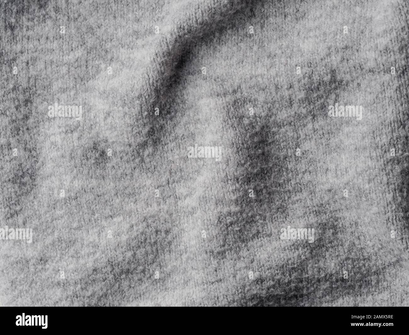 Gray sweater fabric texture. Clothes sweater background with folds ...