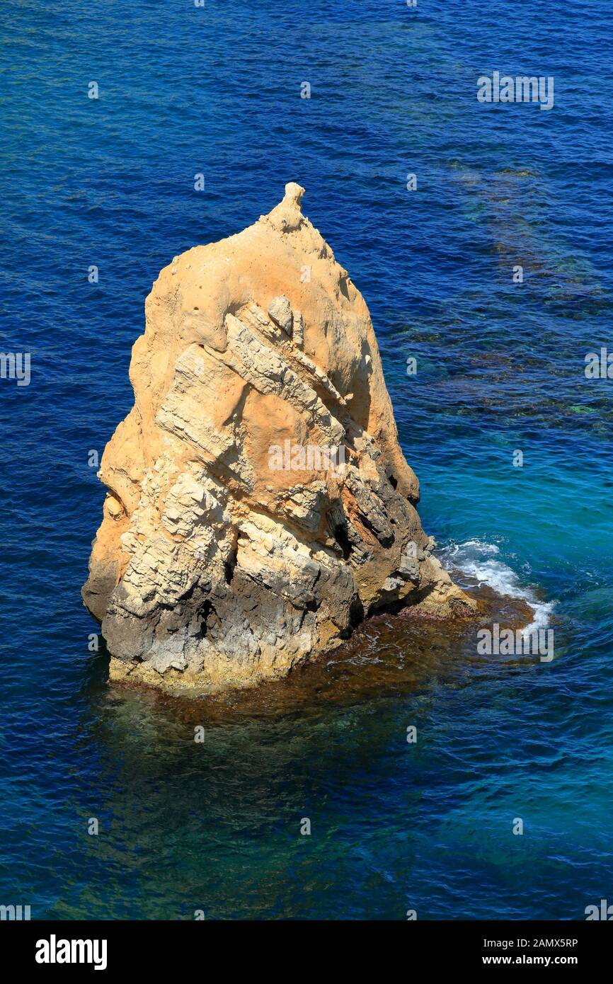 Lone rock stone in the sea Stock Photo - Alamy