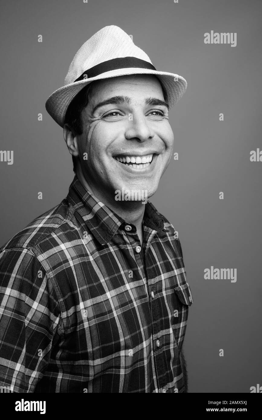Happy handsome persian man thinking hi-res stock photography and images ...