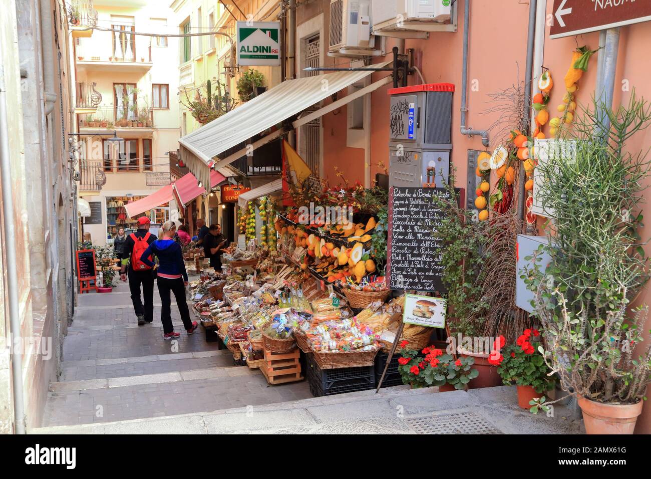 Street with fruit market in Taormina Stock Photo - Alamy