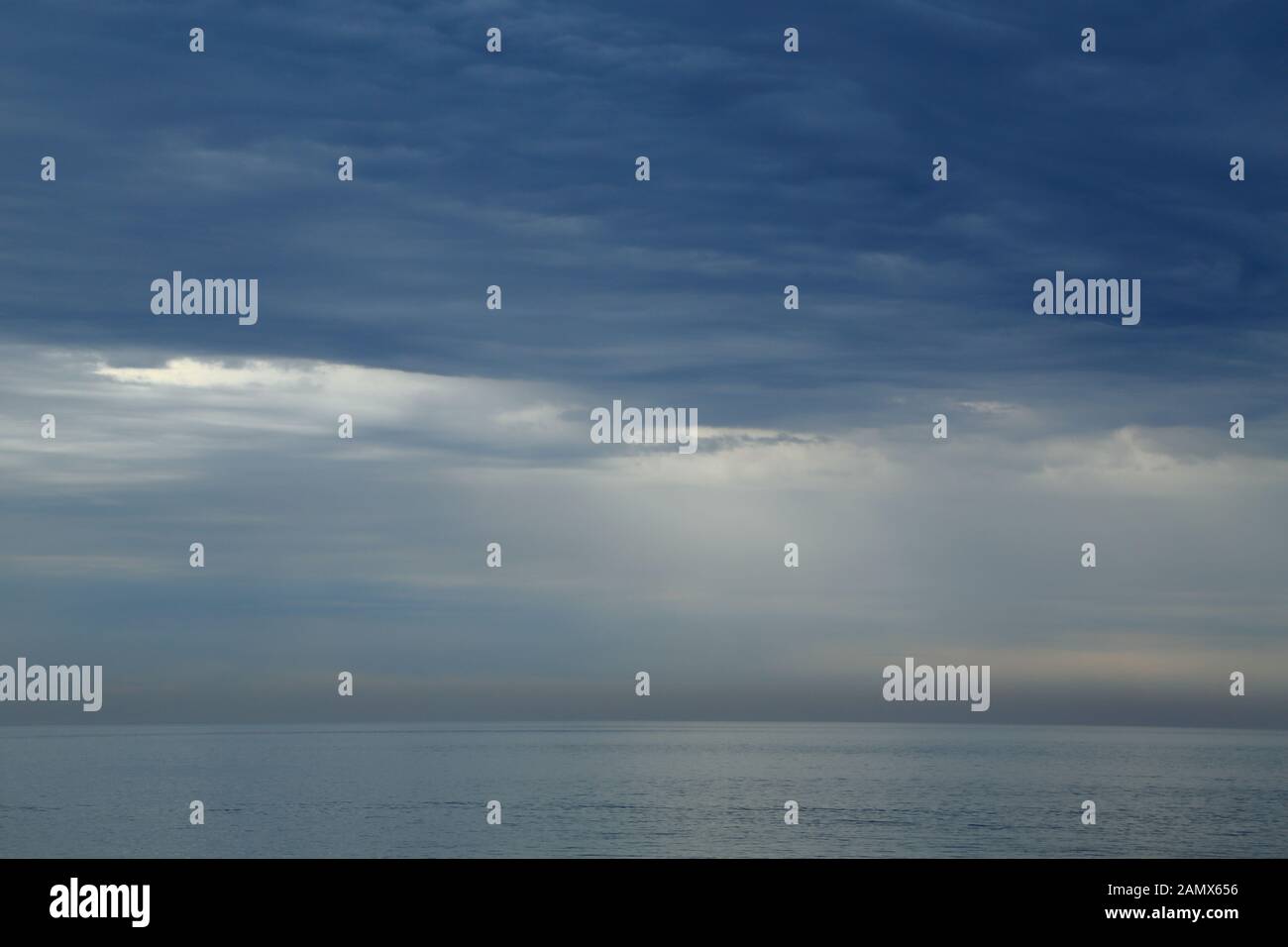 Sea and overcast sky background Stock Photo - Alamy