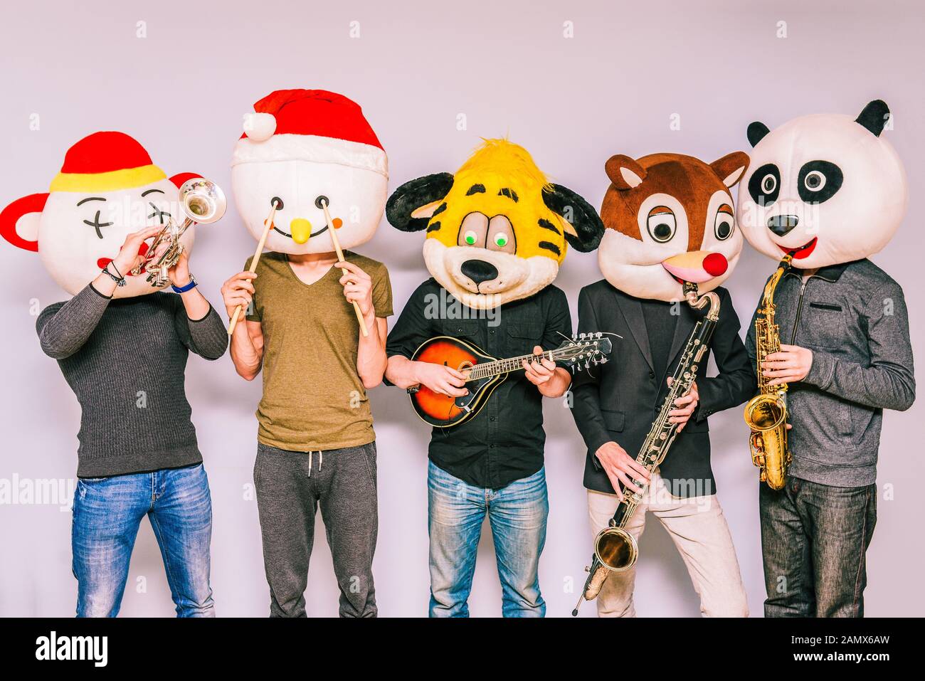 A group of people with musical instruments. Hands hold musical ...