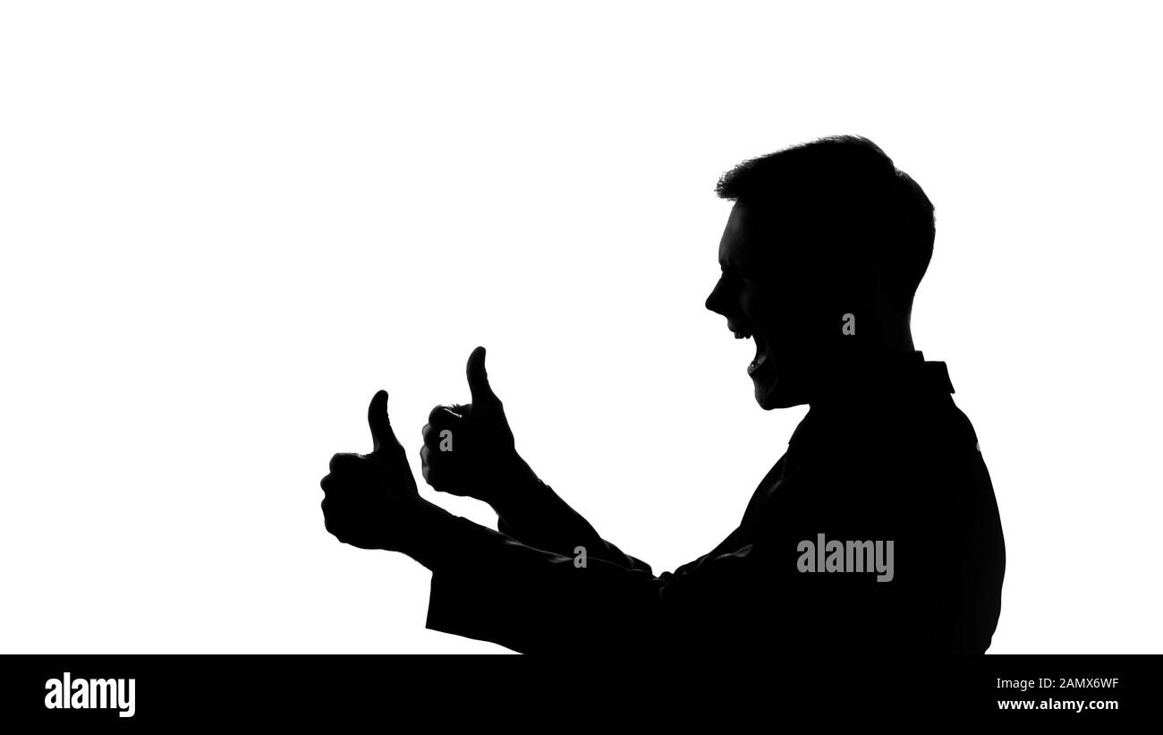 Man showing thumbs up, silhouette side view, celebration of successful ...