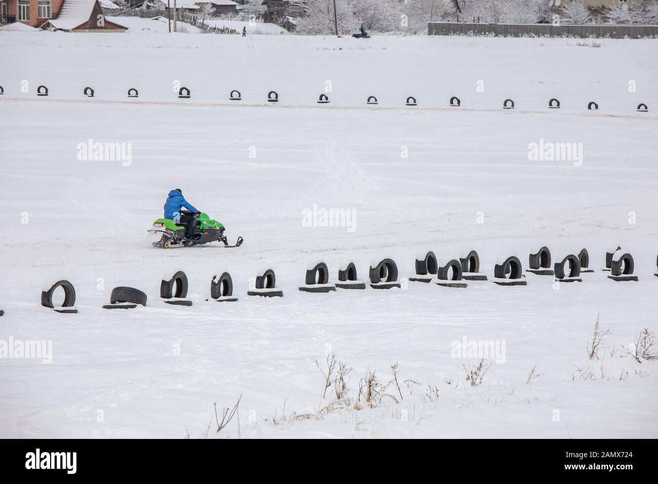 Young people on snowmobile hi-res stock photography and images - Alamy