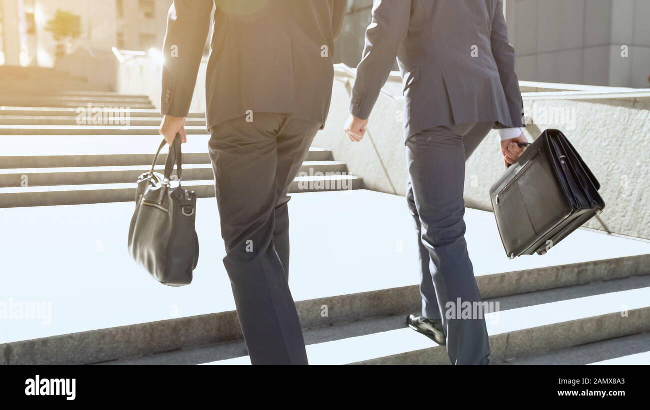Businessmen climbing stairs hi-res stock photography and images - Alamy