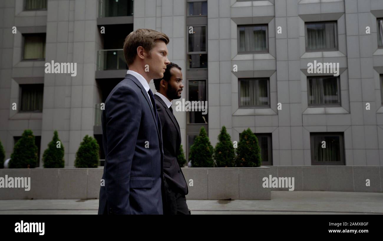 Business men in suits hi-res stock photography and images - Alamy