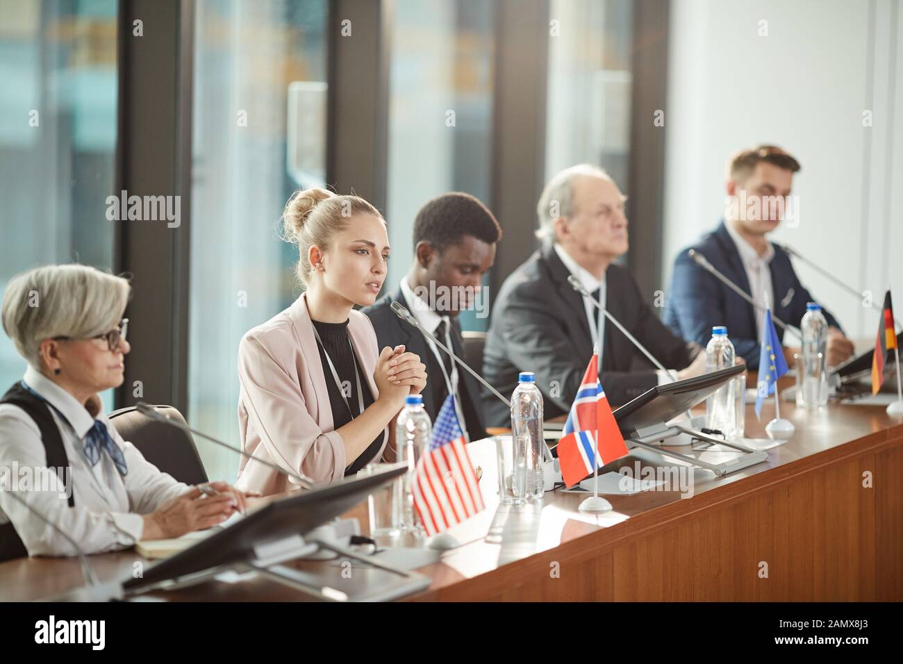 Sitting meeting smiling microphone communication hi-res stock ...