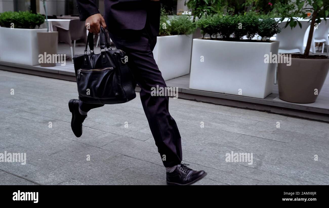 Hurrying into office building hi-res stock photography and images - Alamy
