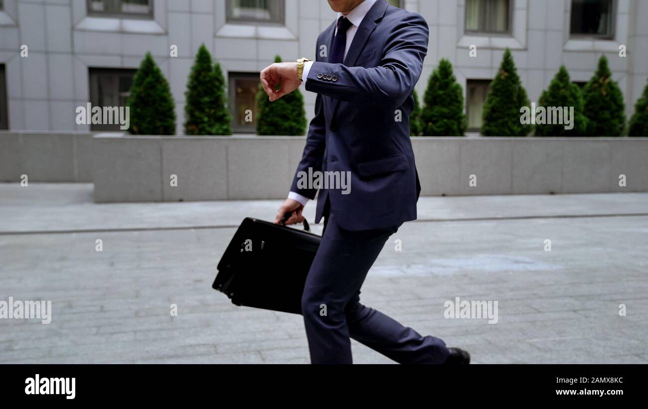 Hurrying into office building hi-res stock photography and images - Alamy