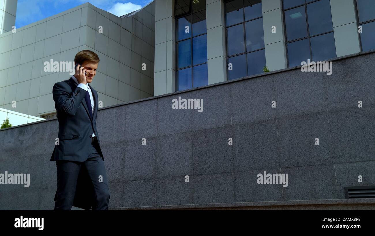 Extremely happy young man talking hi-res stock photography and images ...
