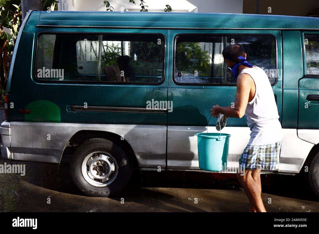 Antipolo City, Philippines - January 13, 2020: Residents clean their ...