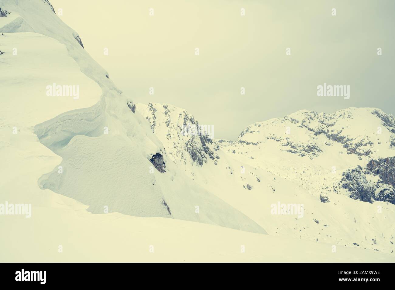Detail of snow cornice forming on mountain ridge Stock Photo - Alamy