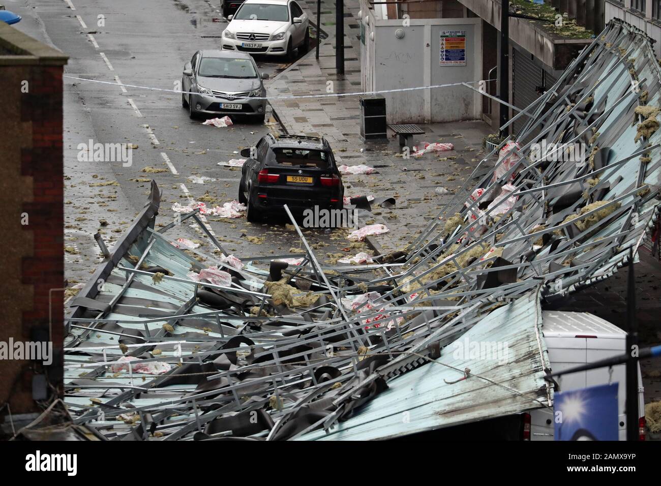 Clear-up work continues in Slough High Street after a roof was blown ...