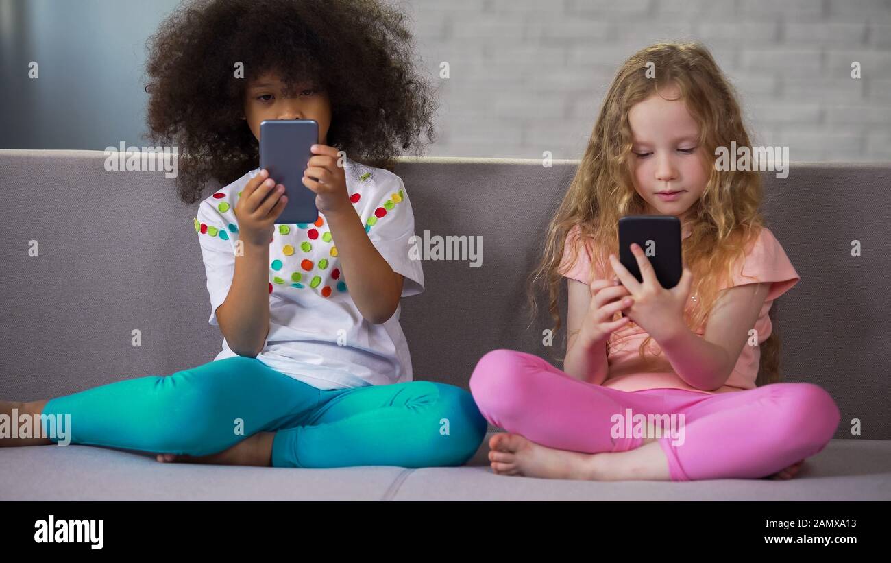 Two beautiful girls on couch hi-res stock photography and images - Alamy