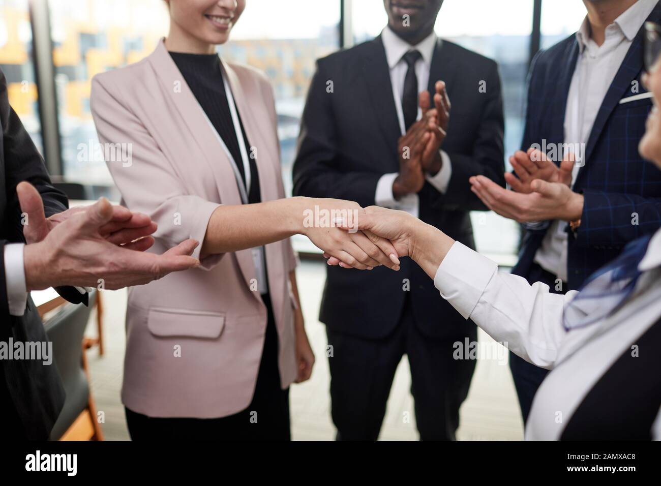 Group of business people standing and clapping they shaking hand to ...