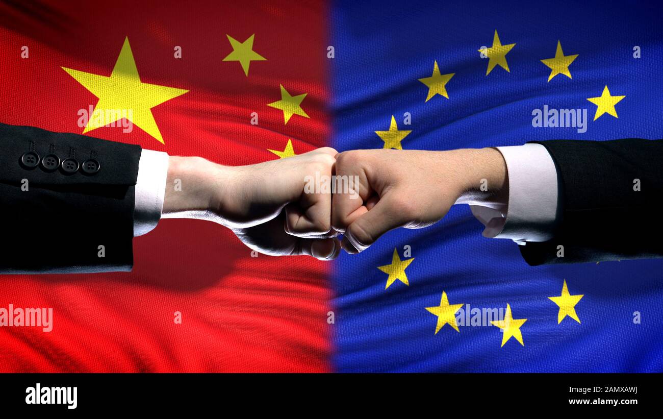China vs EU conflict, international relations crisis, fists on flag ...