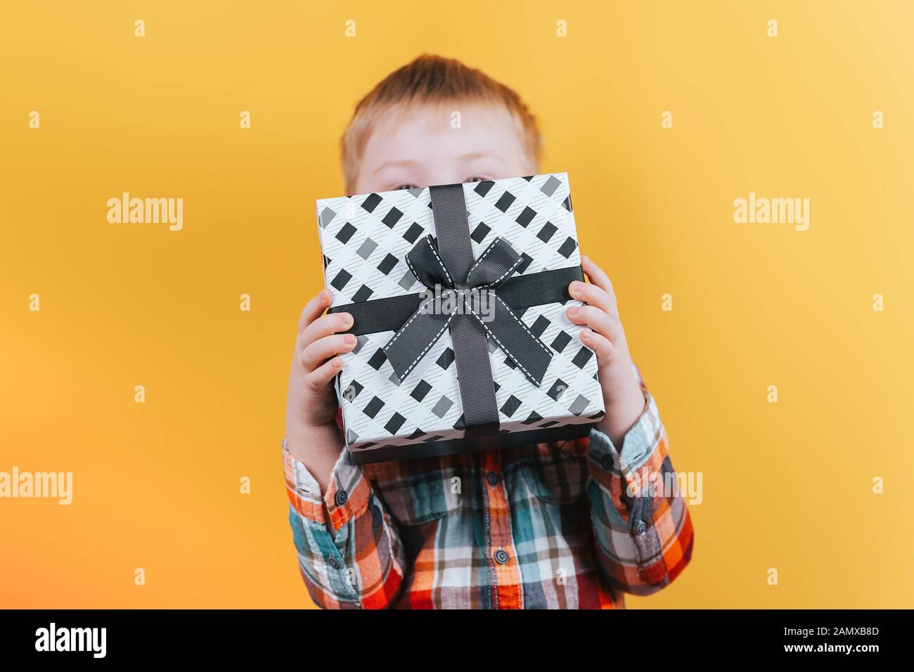 boy holding present Stock Photo - Alamy