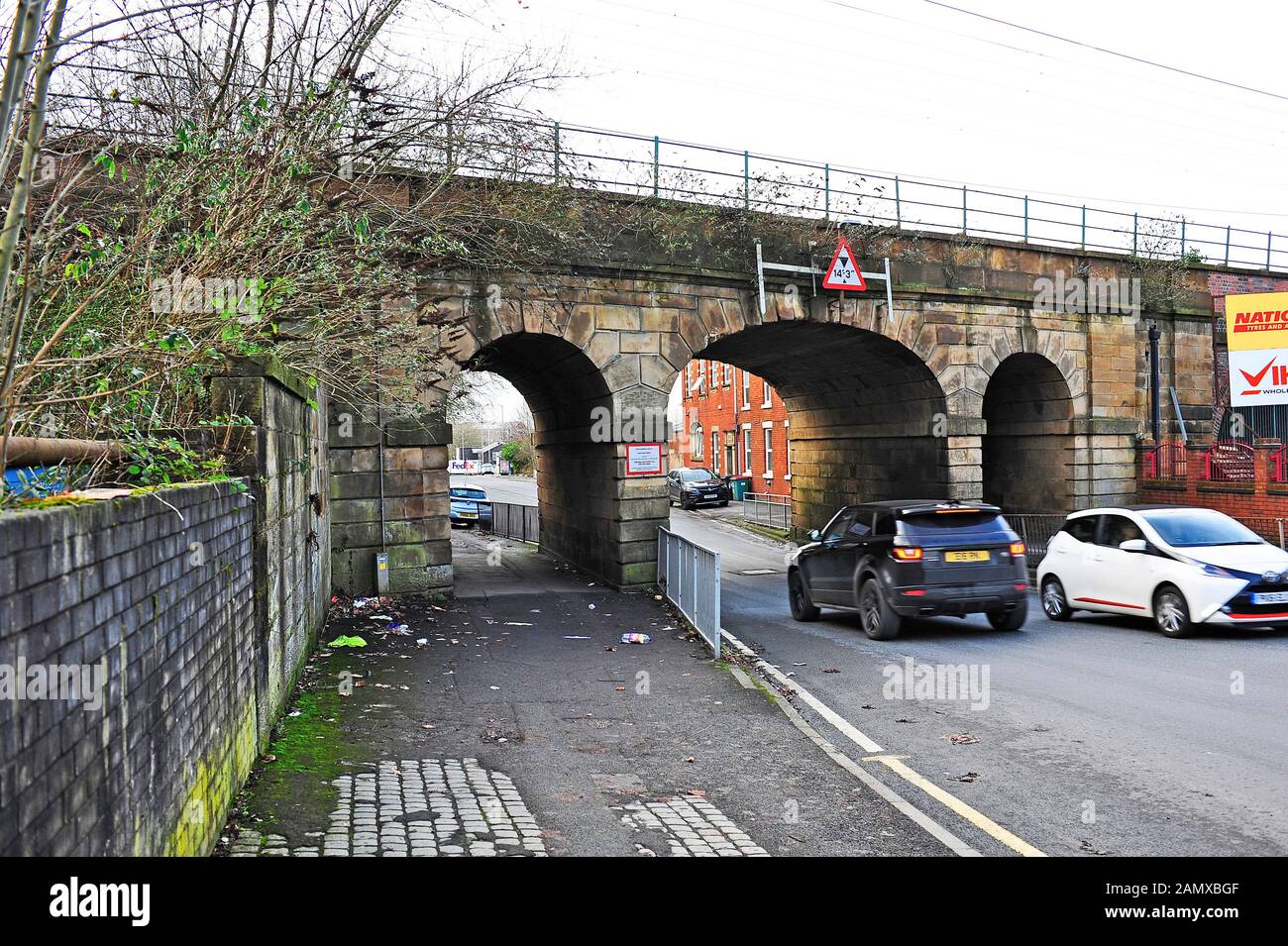 Road traffic traveling under Fylde Road railway bridge,Preston Stock ...