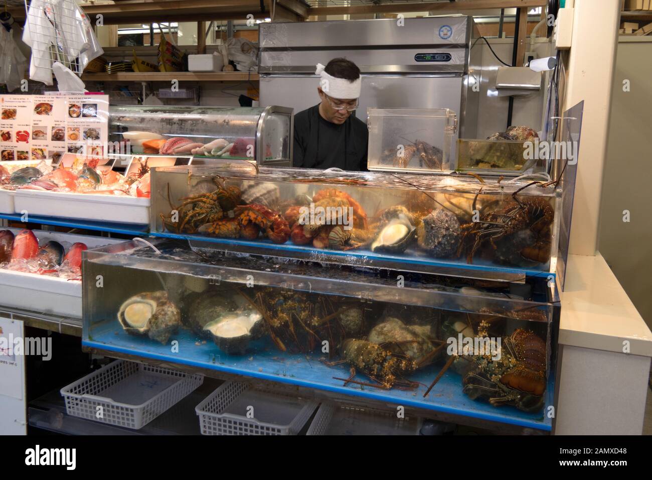 Japanese man working at Makishi Public Market in Naha, Okinawa, Japan ...