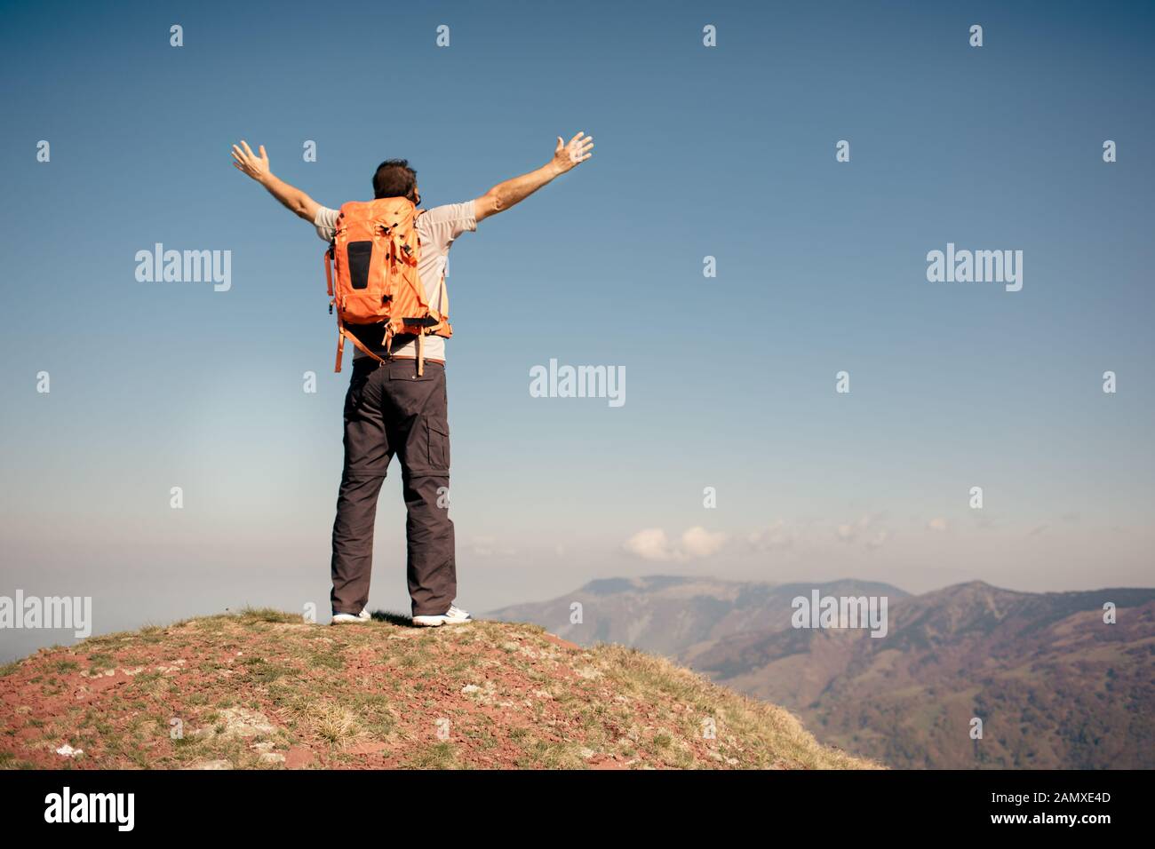 Male hiker raised hands hi-res stock photography and images - Alamy