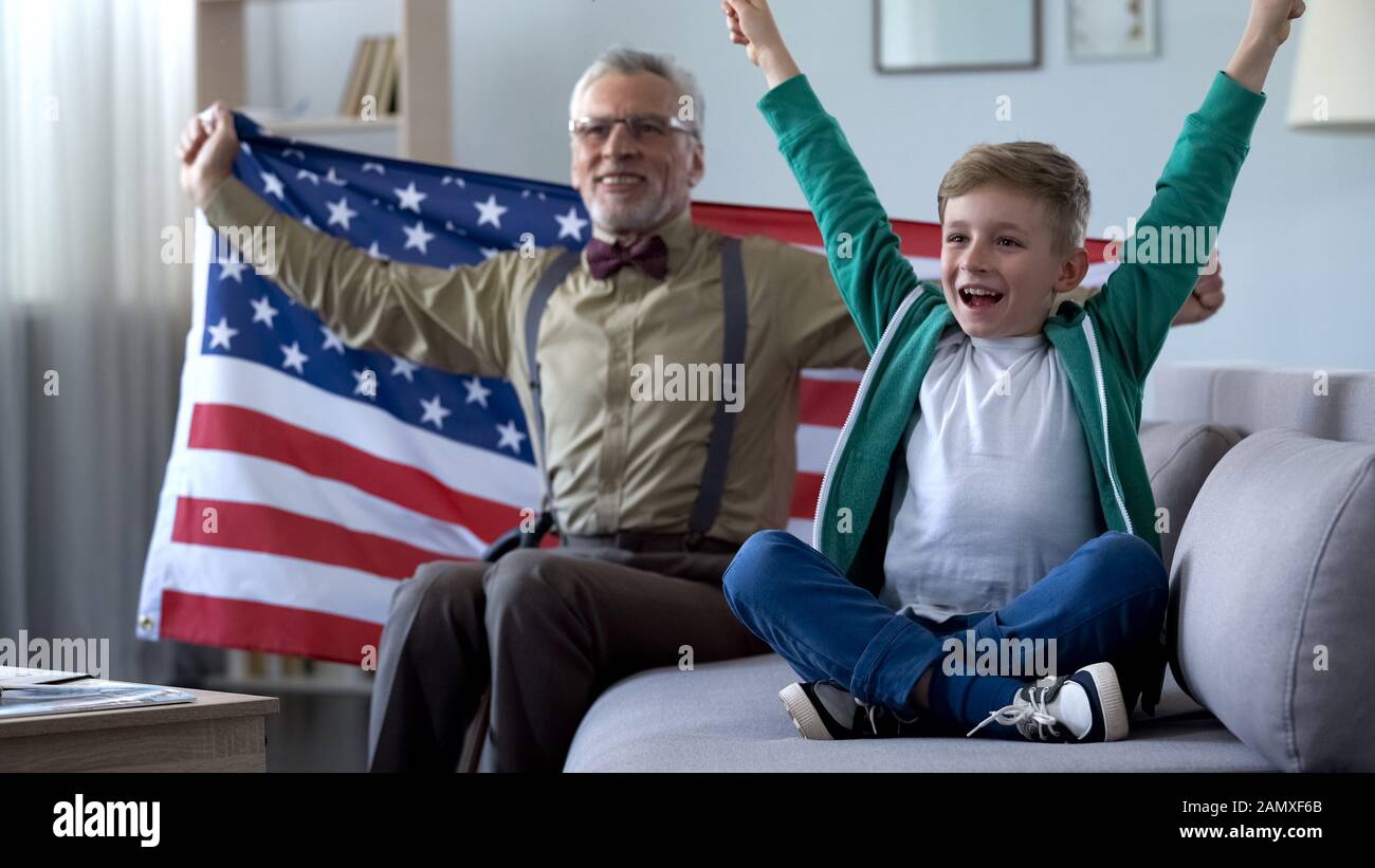 Boy grandpa waving american flag hi-res stock photography and images ...