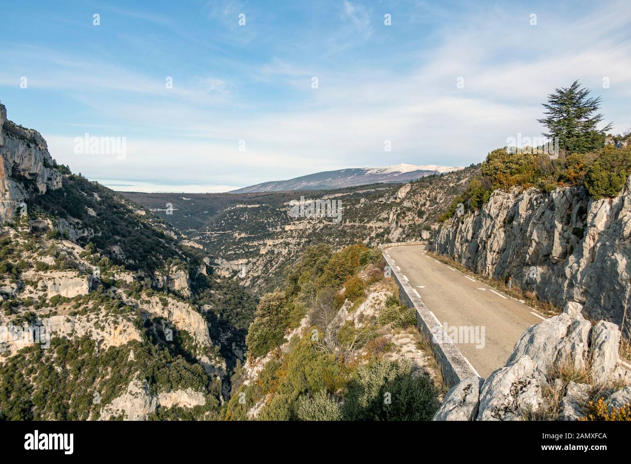 Stunning view with mountain landscape, cliffs and empty road going ...
